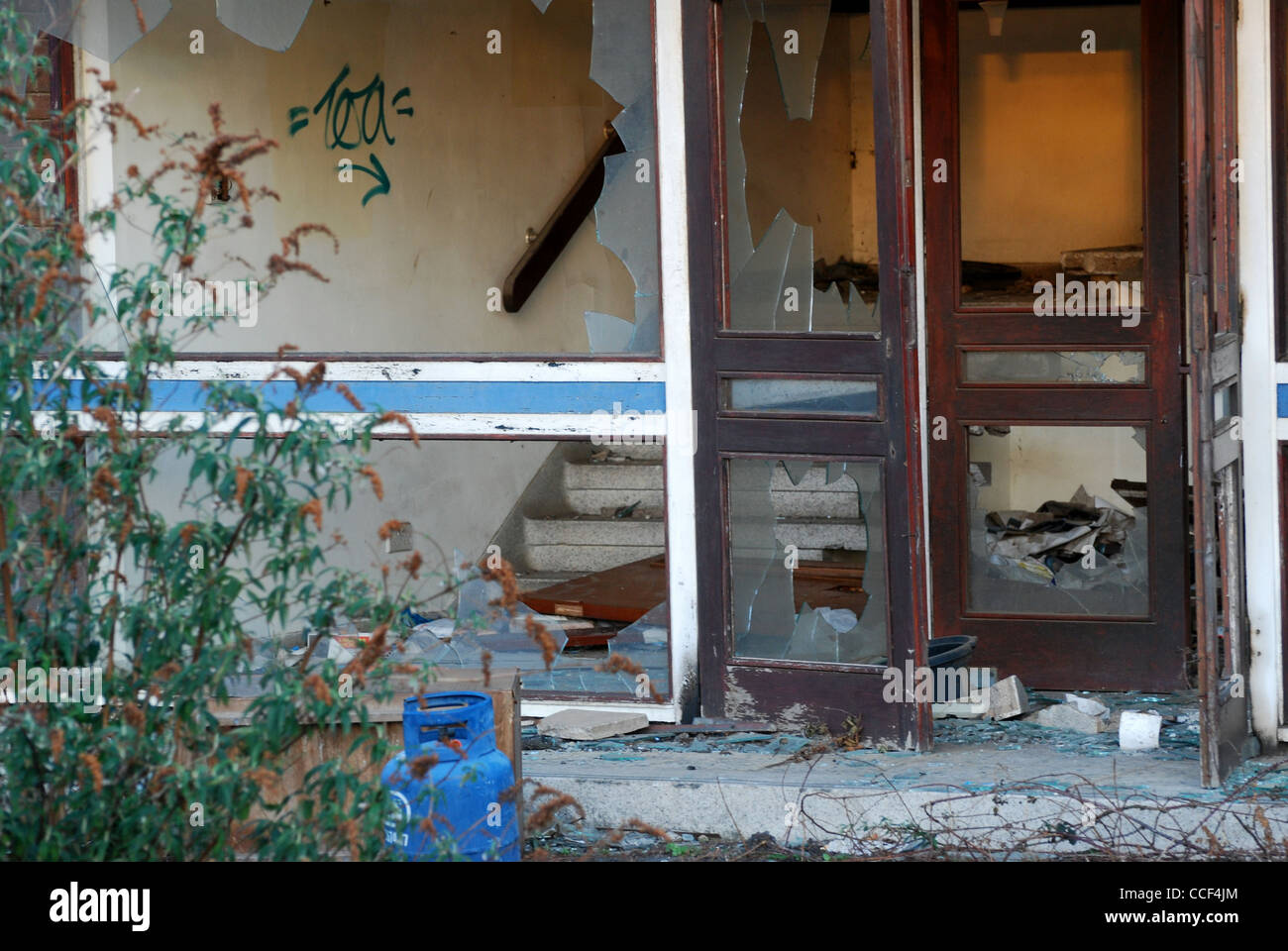 a broken window in a building Stock Photo - Alamy