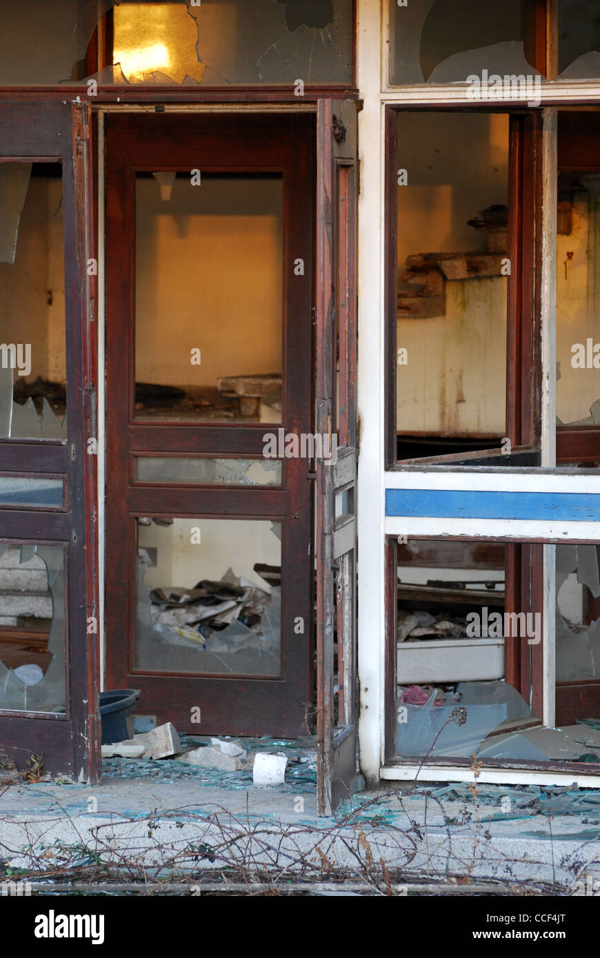 a broken window in a badly damaged building Stock Photo - Alamy