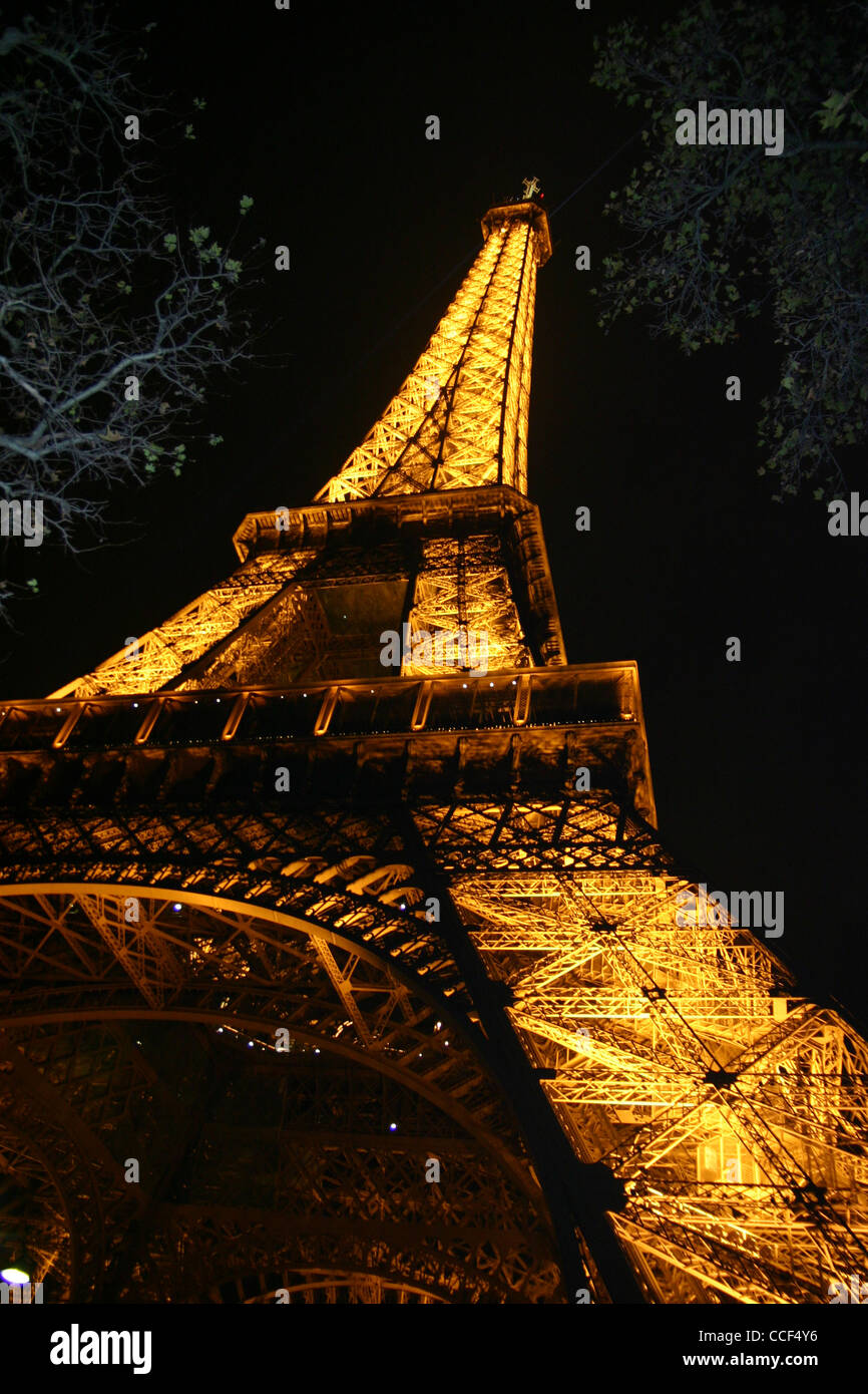 The Eiffel tower in Paris lit up at night Stock Photo - Alamy