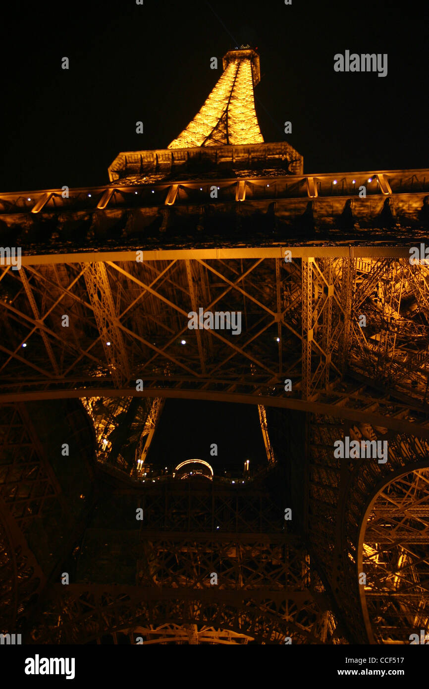 The Eiffel tower in Paris lit up at night Stock Photo - Alamy