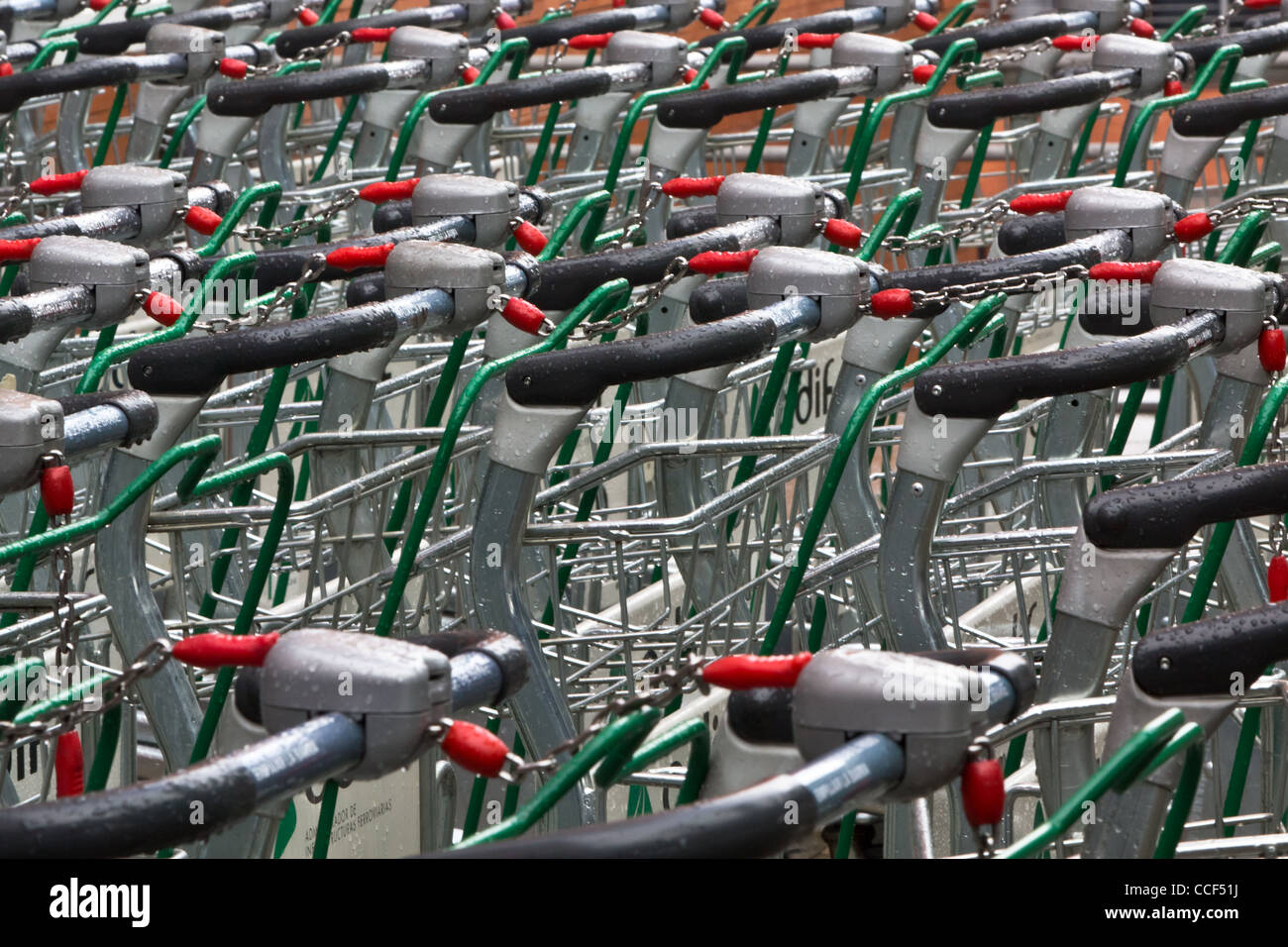A set of wet trolleys after the rain in Madrid Stock Photo - Alamy