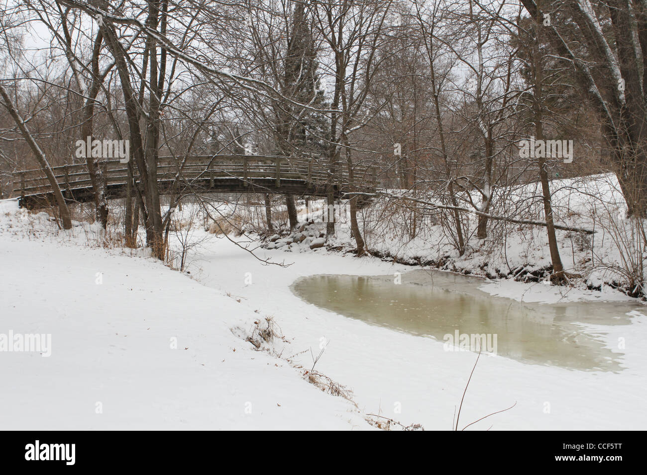 A foot bridge over a partially frozen creek in Minneapolis, Minnesota ...