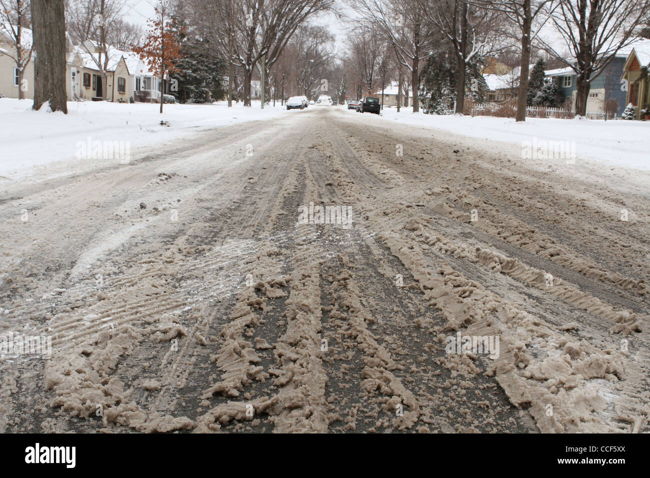 A slushy, snowy street in a residential area in Minneapolis, Minnesota ...