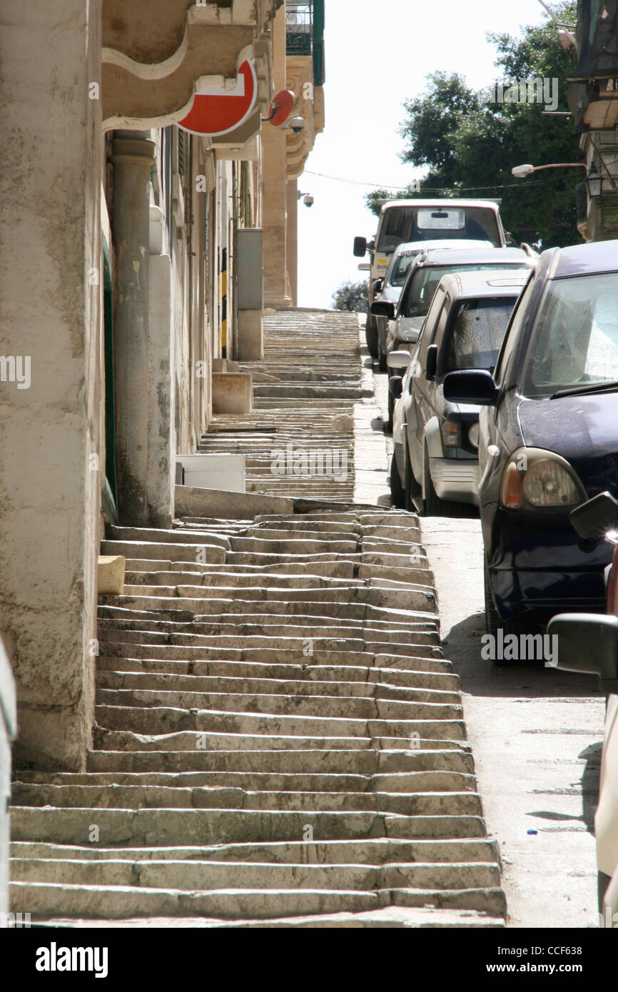 Steep stone stepped pavement rising from the harbour area in Valletta ...