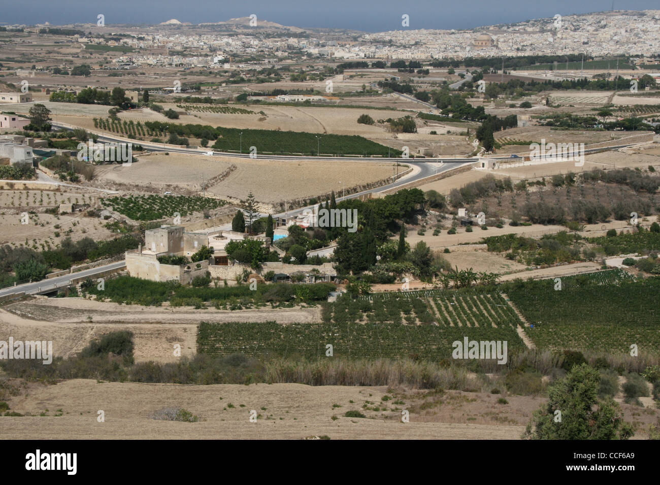 View towards the sea from the walled city of Mdina with green ...