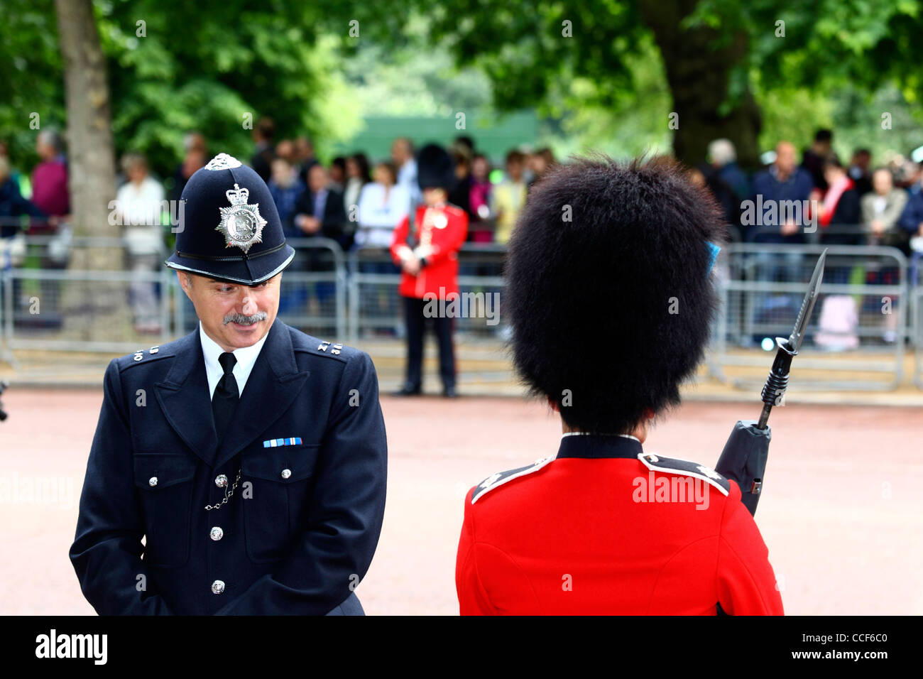 Policeman chatting to Irish guard in Pall Mall before the Trooping the ...