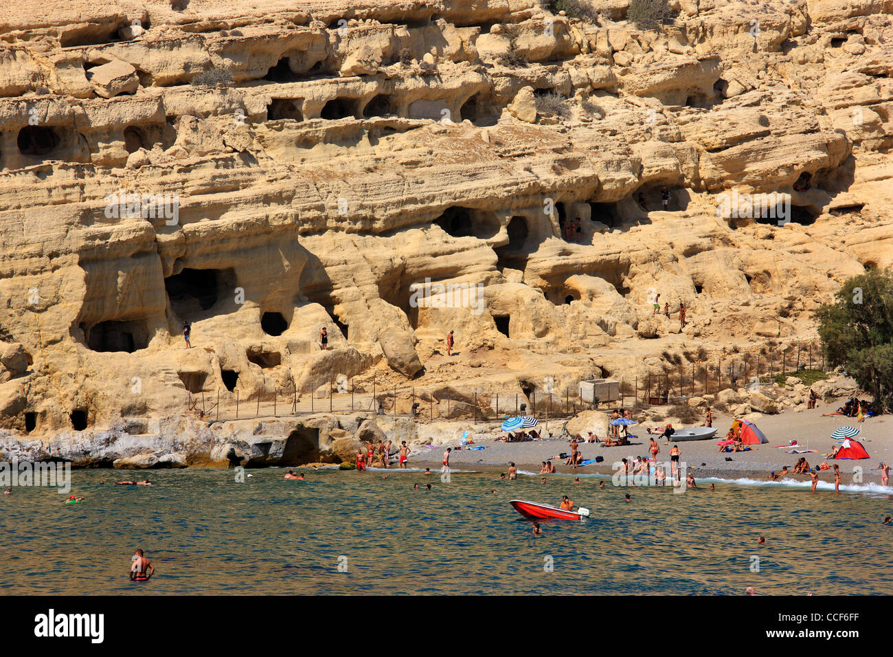 Matala beach with its famous caves, once "home" for many hippies, to ...