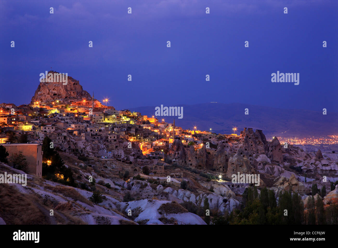 Beautiful Uchisar village with its spectacular rocky castle, at night ...