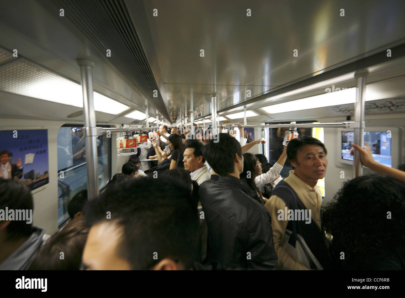 Commuters inside shanghai metro train hi-res stock photography and ...