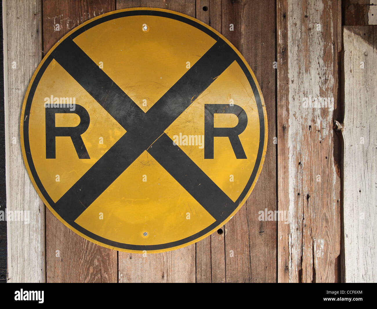 yellow Railroad Crossing sign Stock Photo - Alamy