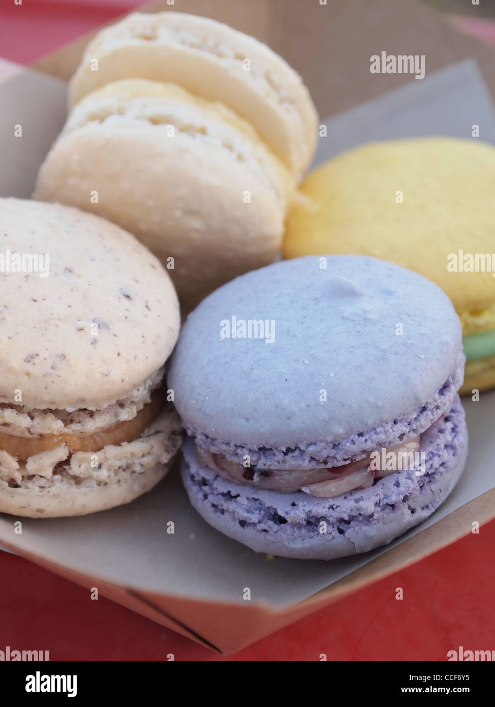Colorful macaron pastries on a paper plate Stock Photo - Alamy