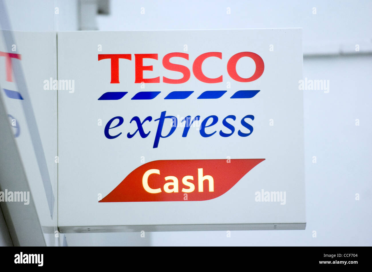 Sign for a cash machine outside a Tesco Express shop in Swansea Stock ...