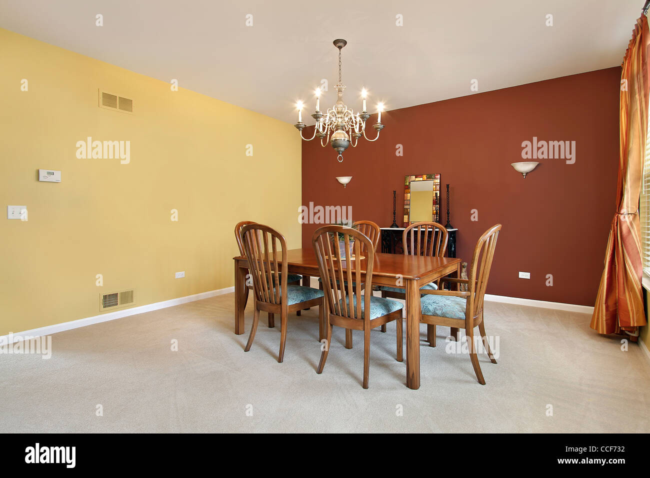 Large dining room with yellow and copper colored walls Stock Photo - Alamy