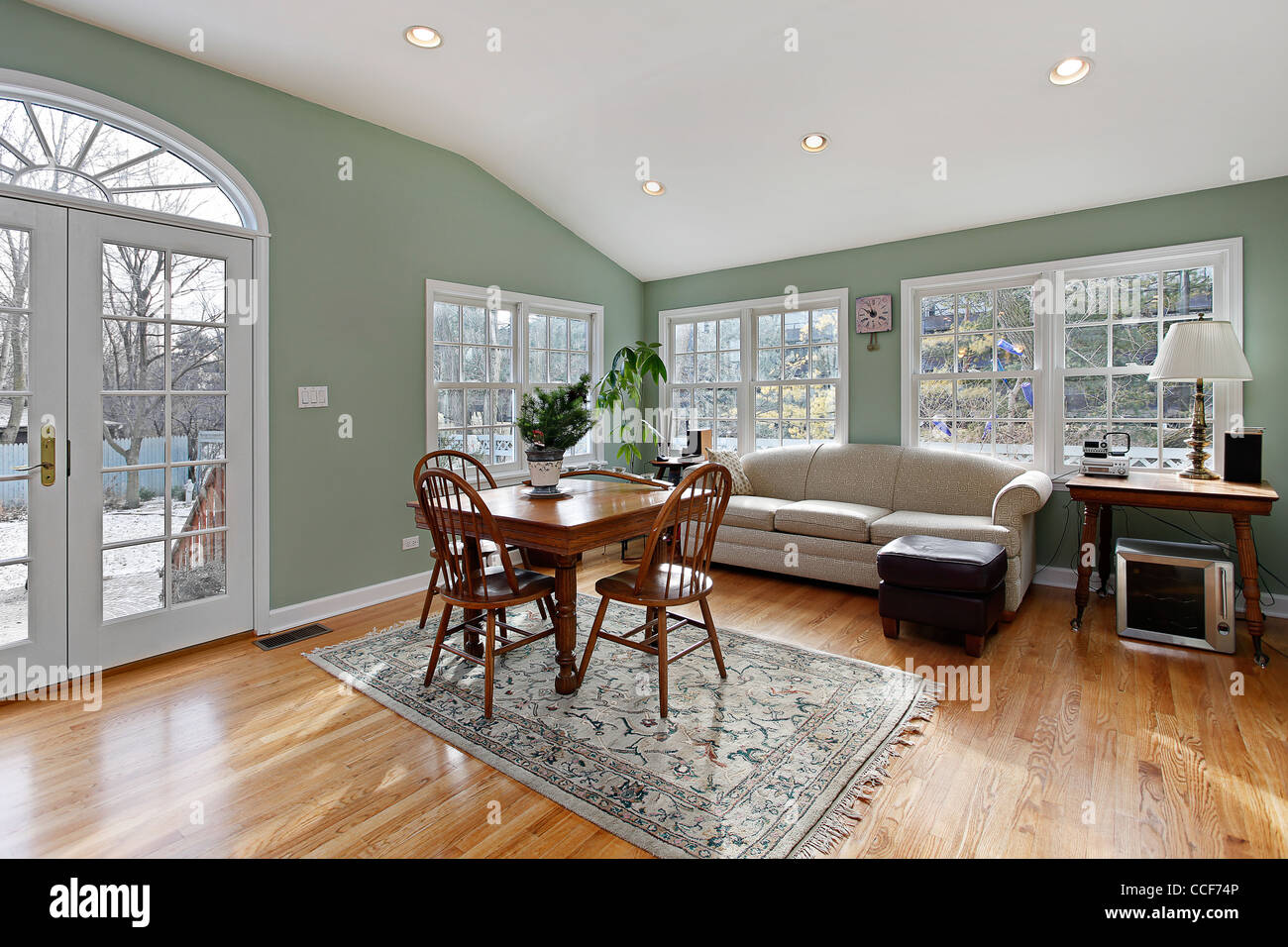 Family room in suburban home with doors to deck Stock Photo - Alamy