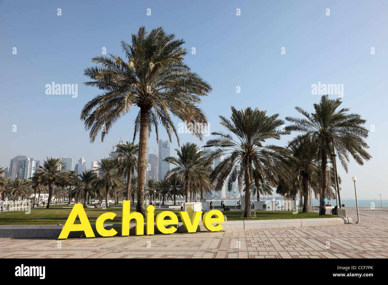 Slogan Achieve on the corniche of Doha, Qatar Stock Photo - Alamy