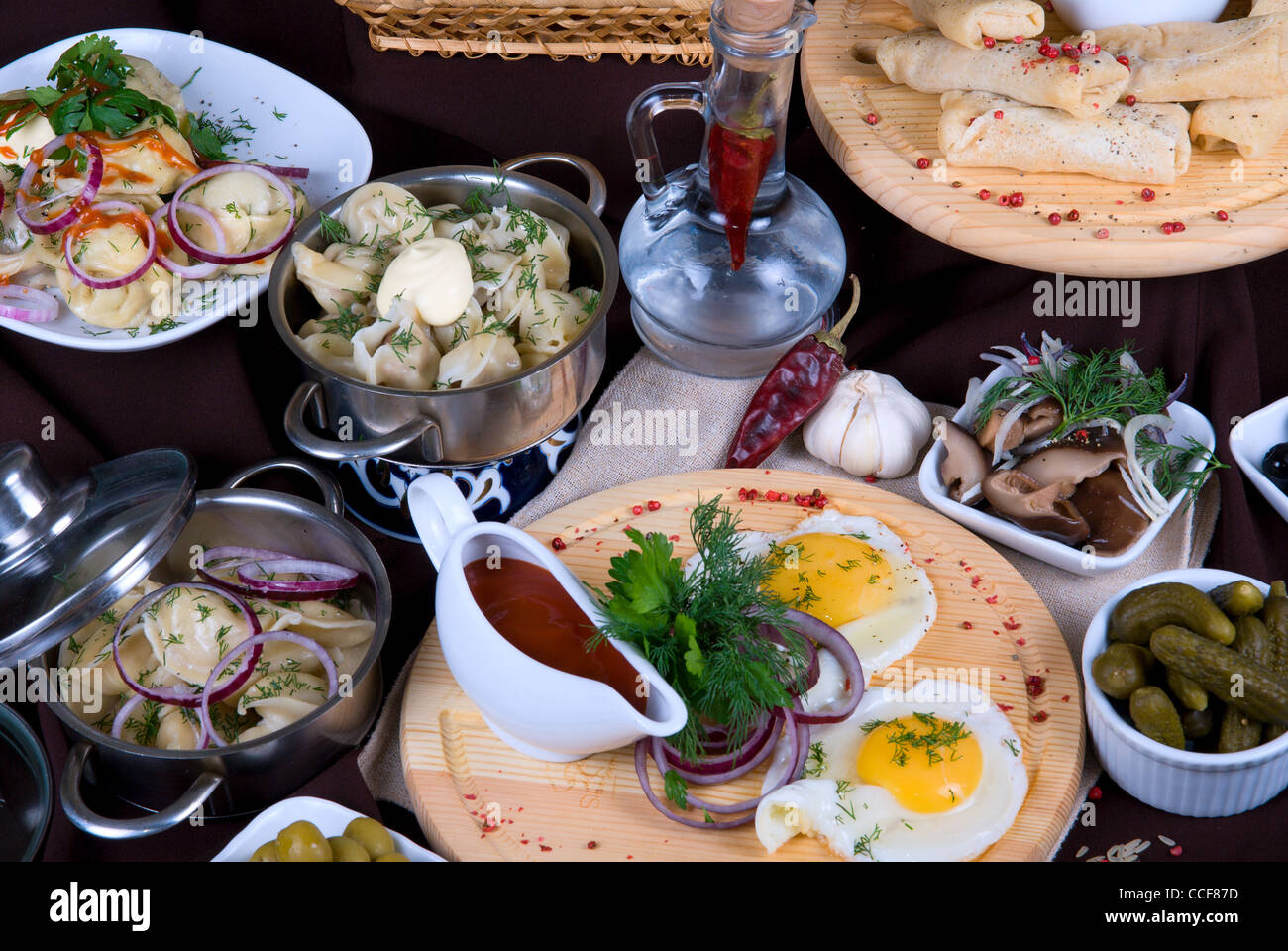 Nosh-up: Many food dishes on the restaurant table Stock Photo - Alamy