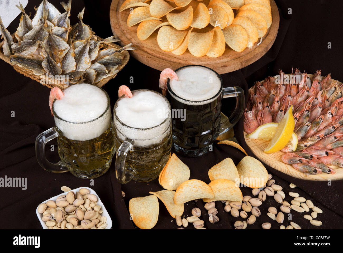 Nosh-up: beer sets and snacks on the restaurant table Stock Photo - Alamy