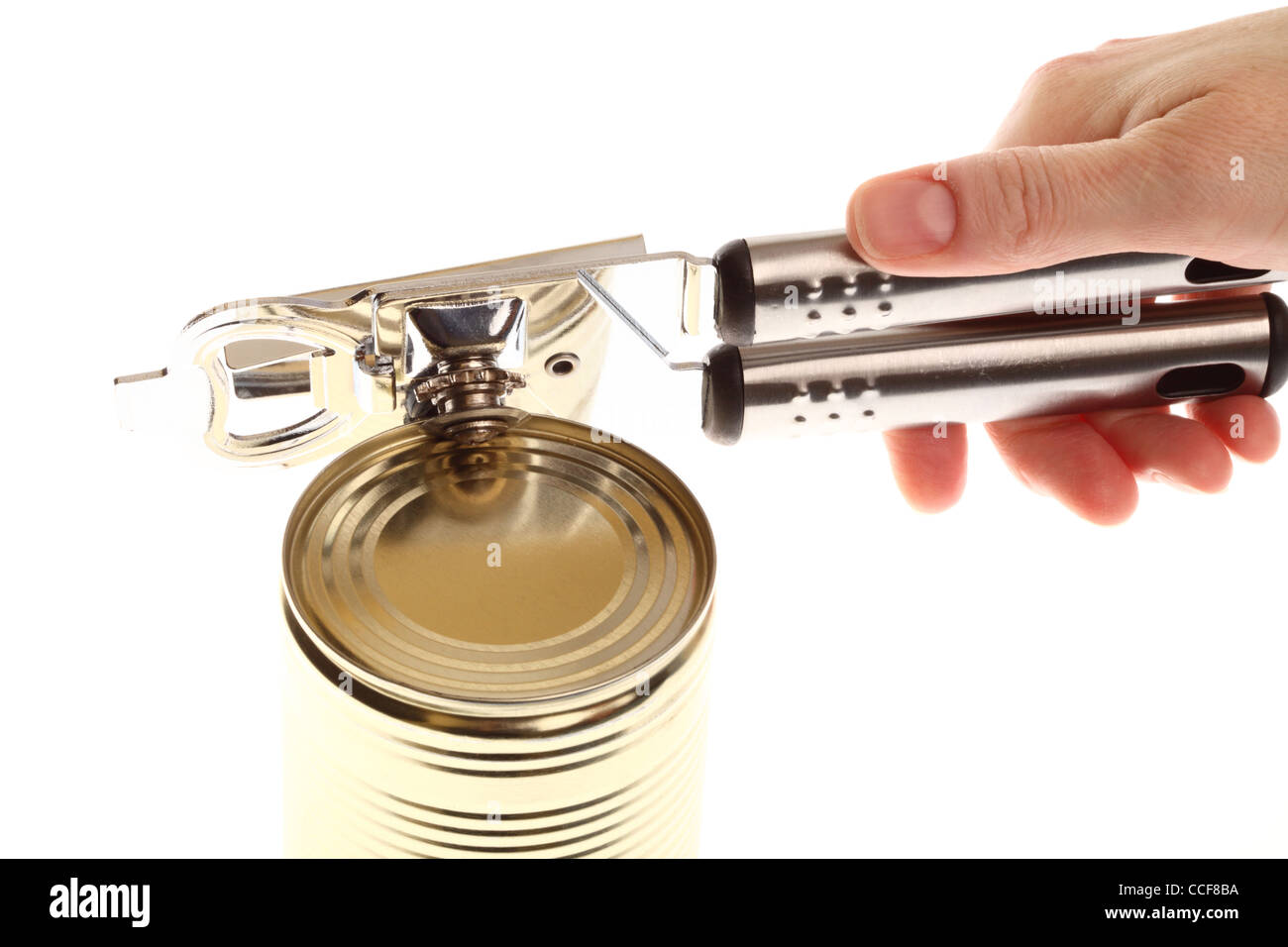Hand and Tin opener opening a can of food isolated on white Stock Photo ...
