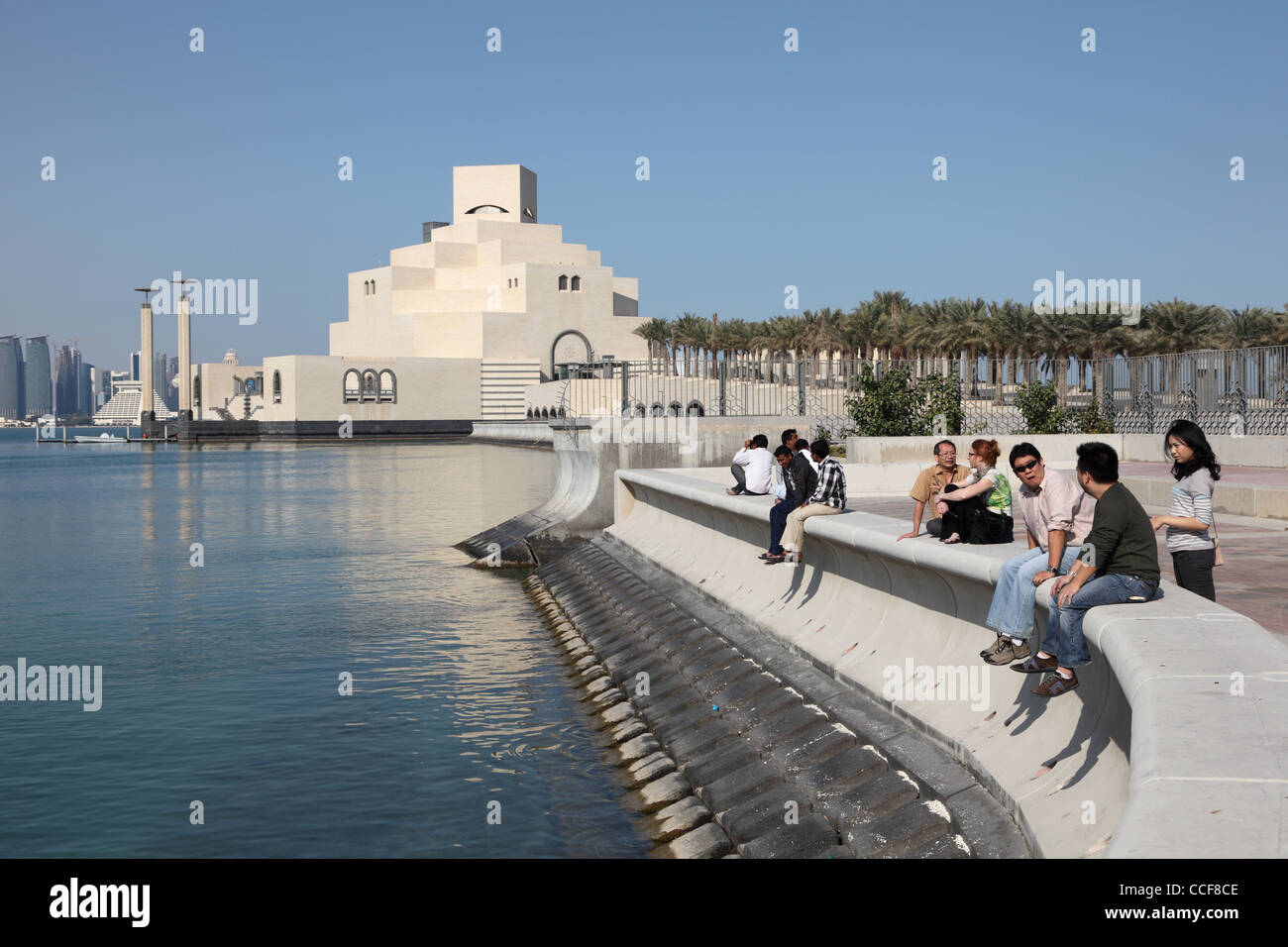 People on the corniche at the Museum of Islamic Art in Doha, Qatar ...