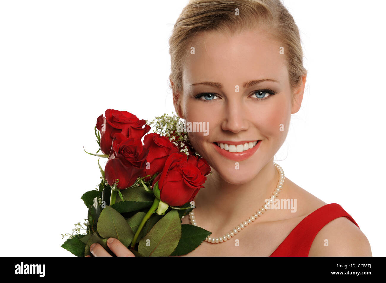 Portrait of beautiful young woman holding red roses isolated over white ...