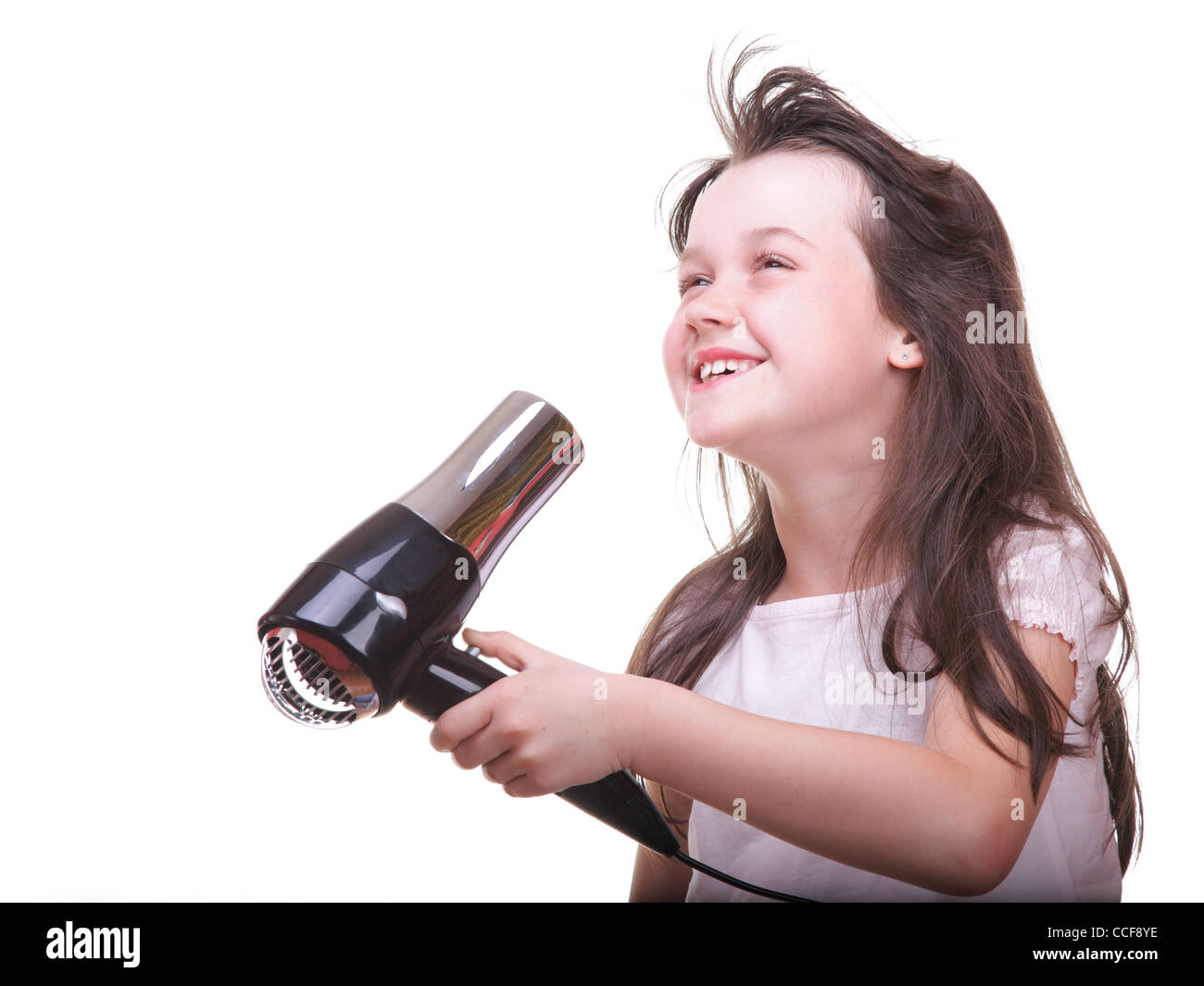 Pretty girl drying her hair hairdryer isolated on white Stock Photo - Alamy