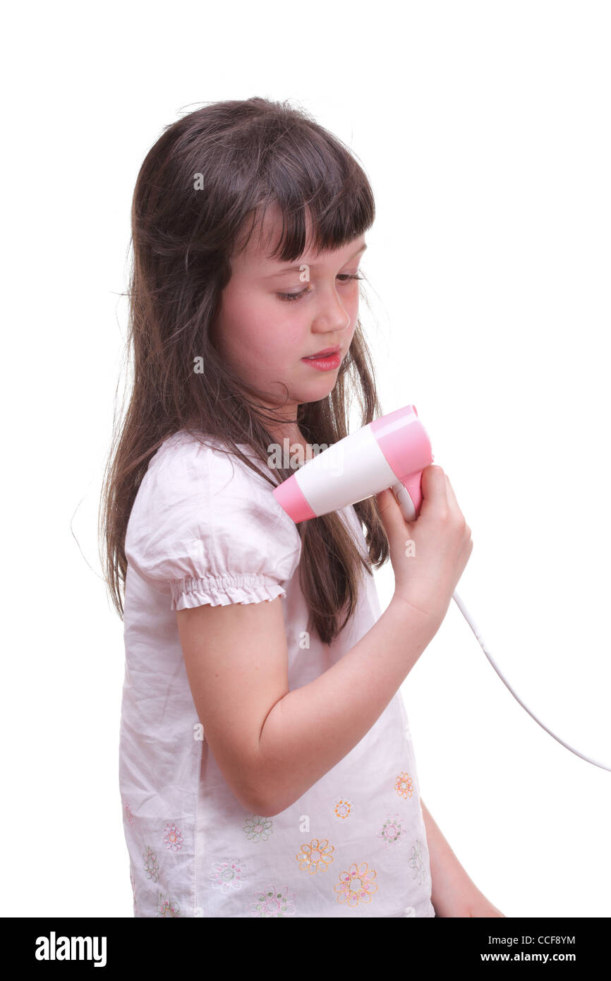 Pretty girl drying her hair hairdryer isolated on white Stock Photo - Alamy