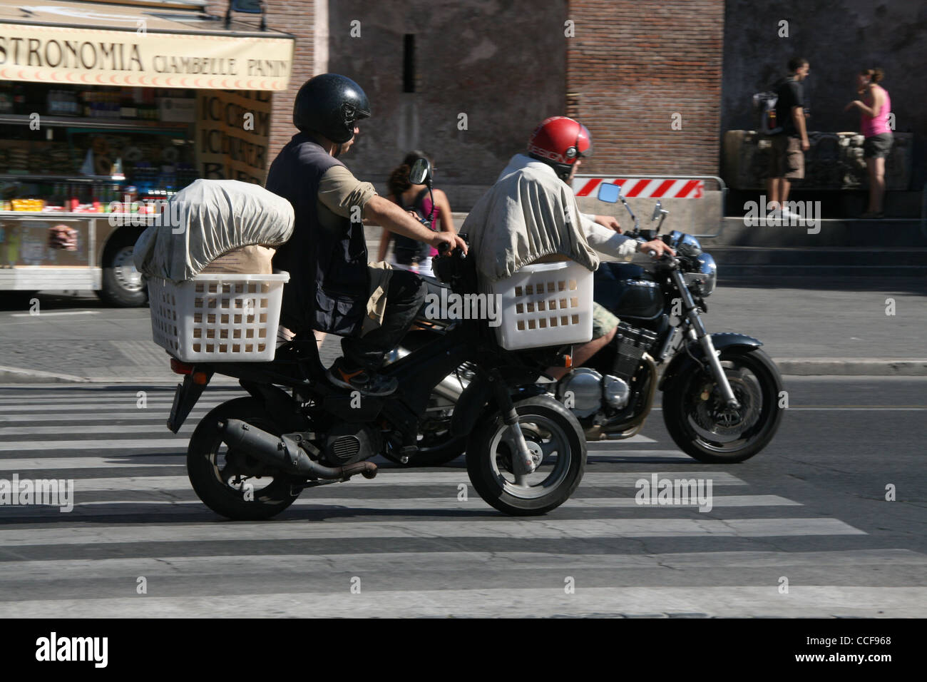 people riding scooter in rome italy Stock Photo - Alamy