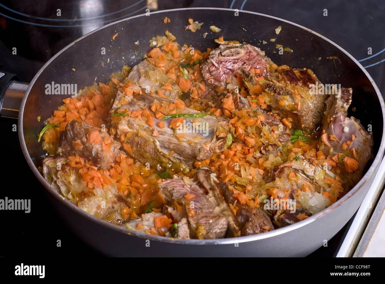 Beef sliced meat cooking in frying pan Stock Photo - Alamy