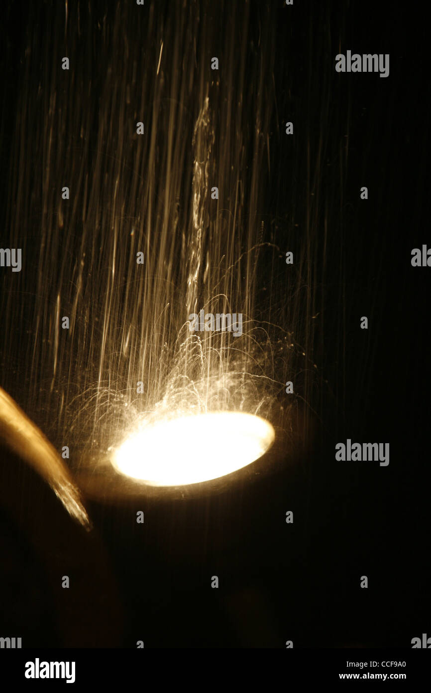 one spot light lamp on ground floor in heavy rain at night Stock Photo ...