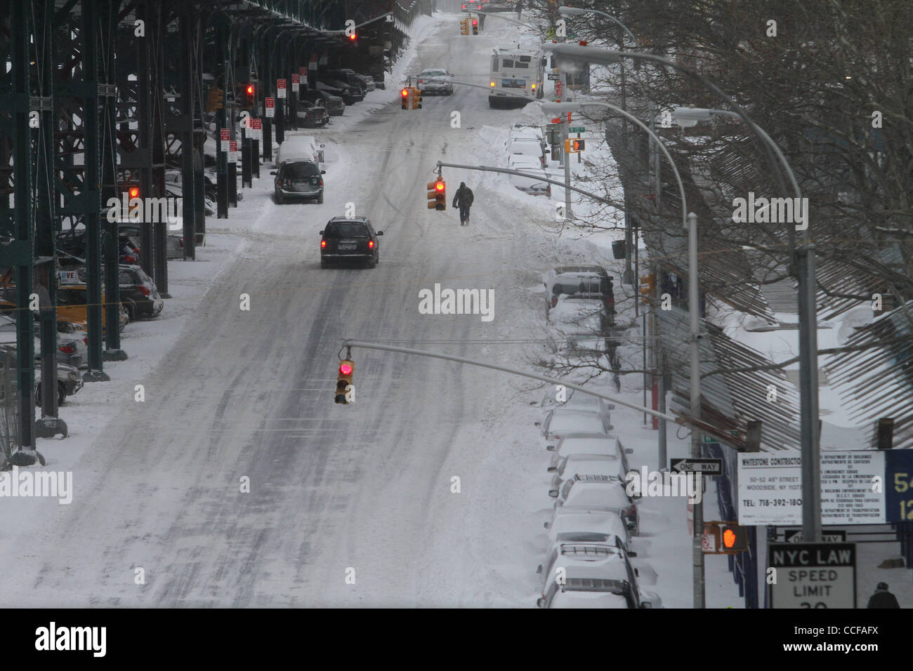 Cars trying to get around in the snow, MTA Buses stock in the middle of ...