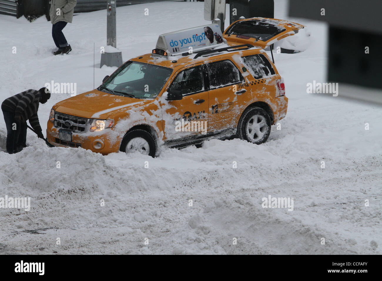 Cars trying to get around in the snow, MTA Buses stock in the middle of ...