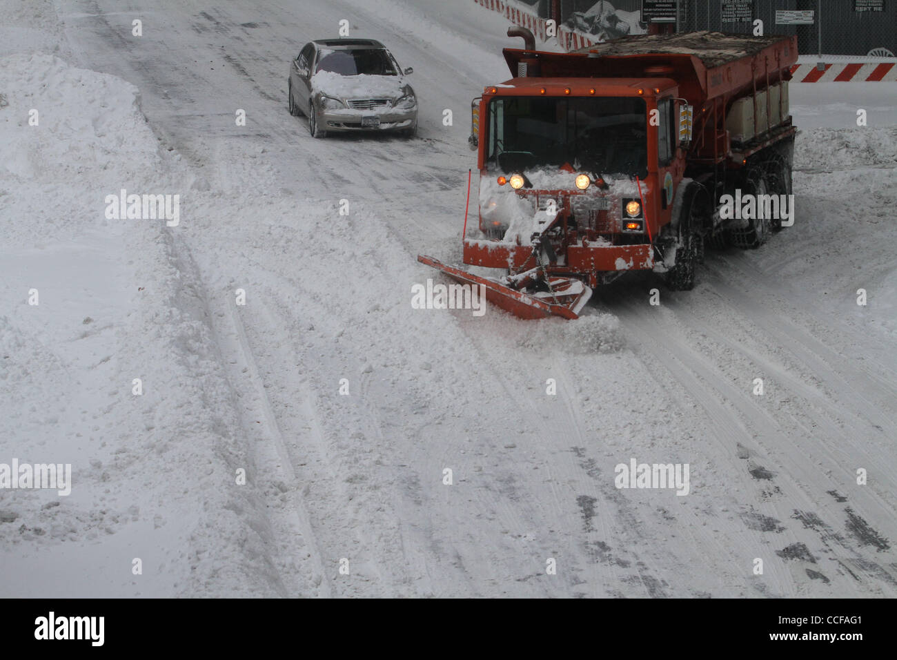 Cars trying to get around in the snow, MTA Buses stock in the middle of ...