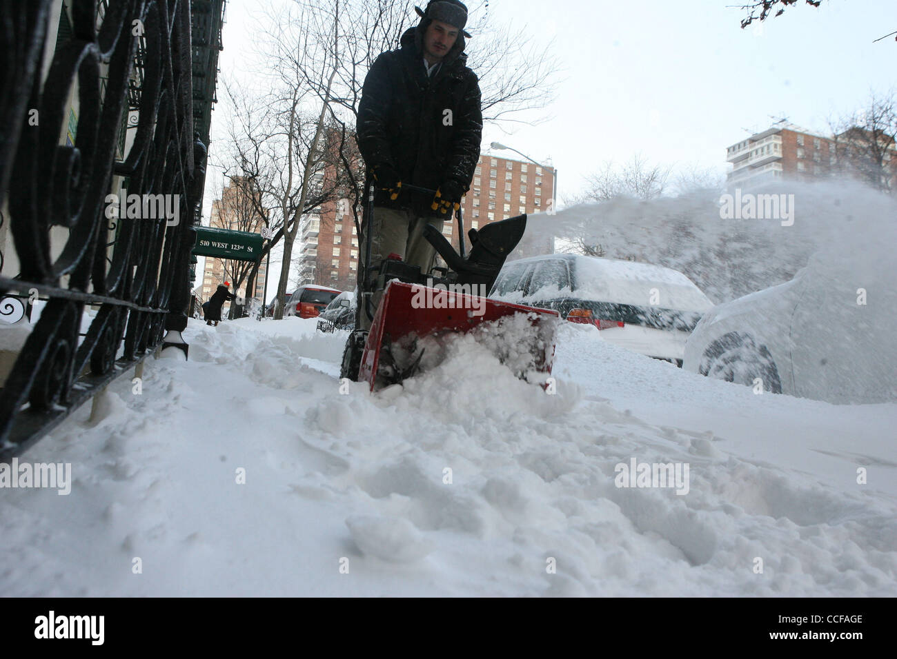 Cars trying to get around in the snow, MTA Buses stock in the middle of ...