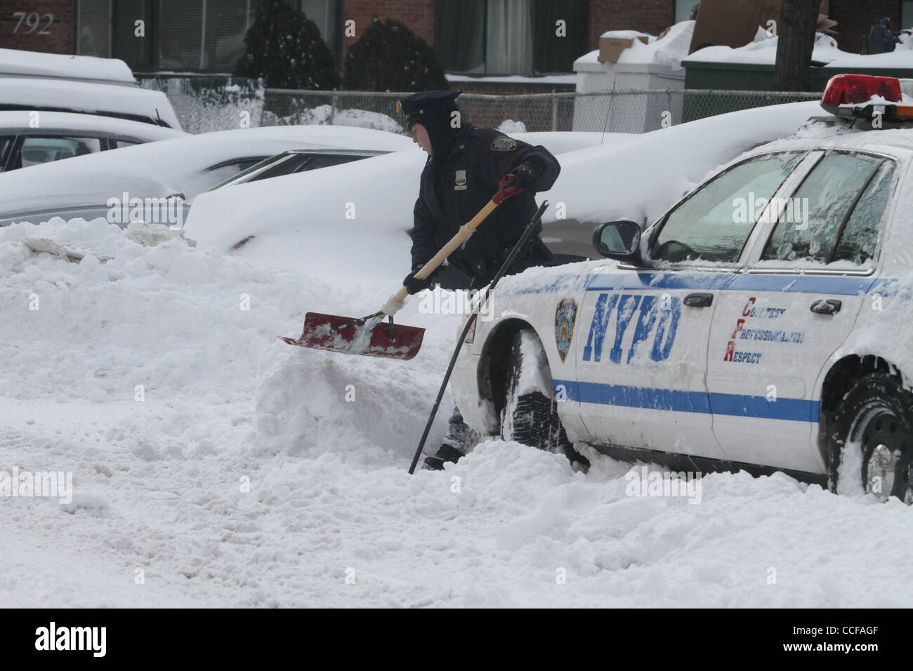 Cars trying to get around in the snow, MTA Buses stock in the middle of ...