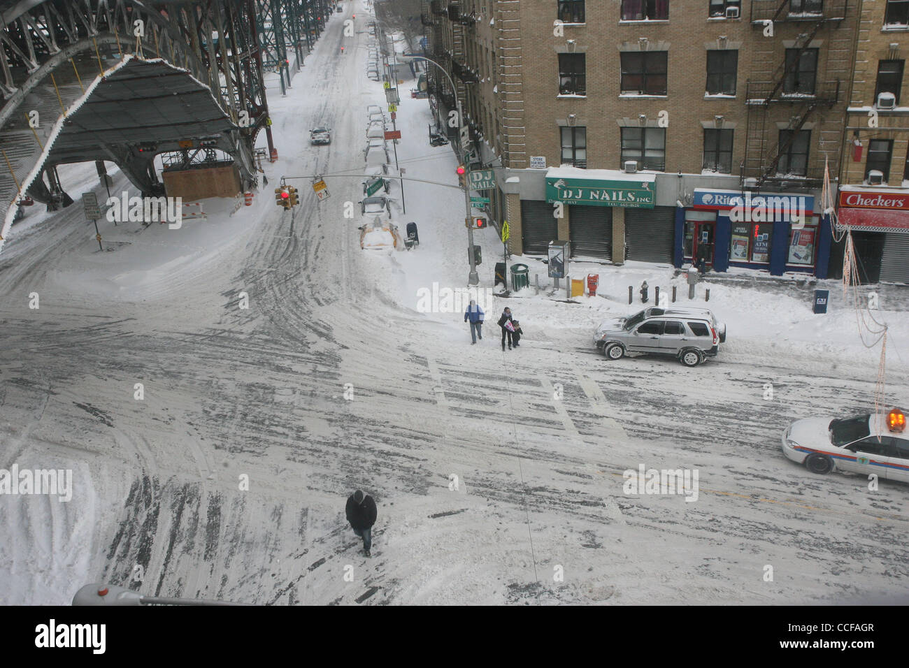 Cars trying to get around in the snow, MTA Buses stock in the middle of ...