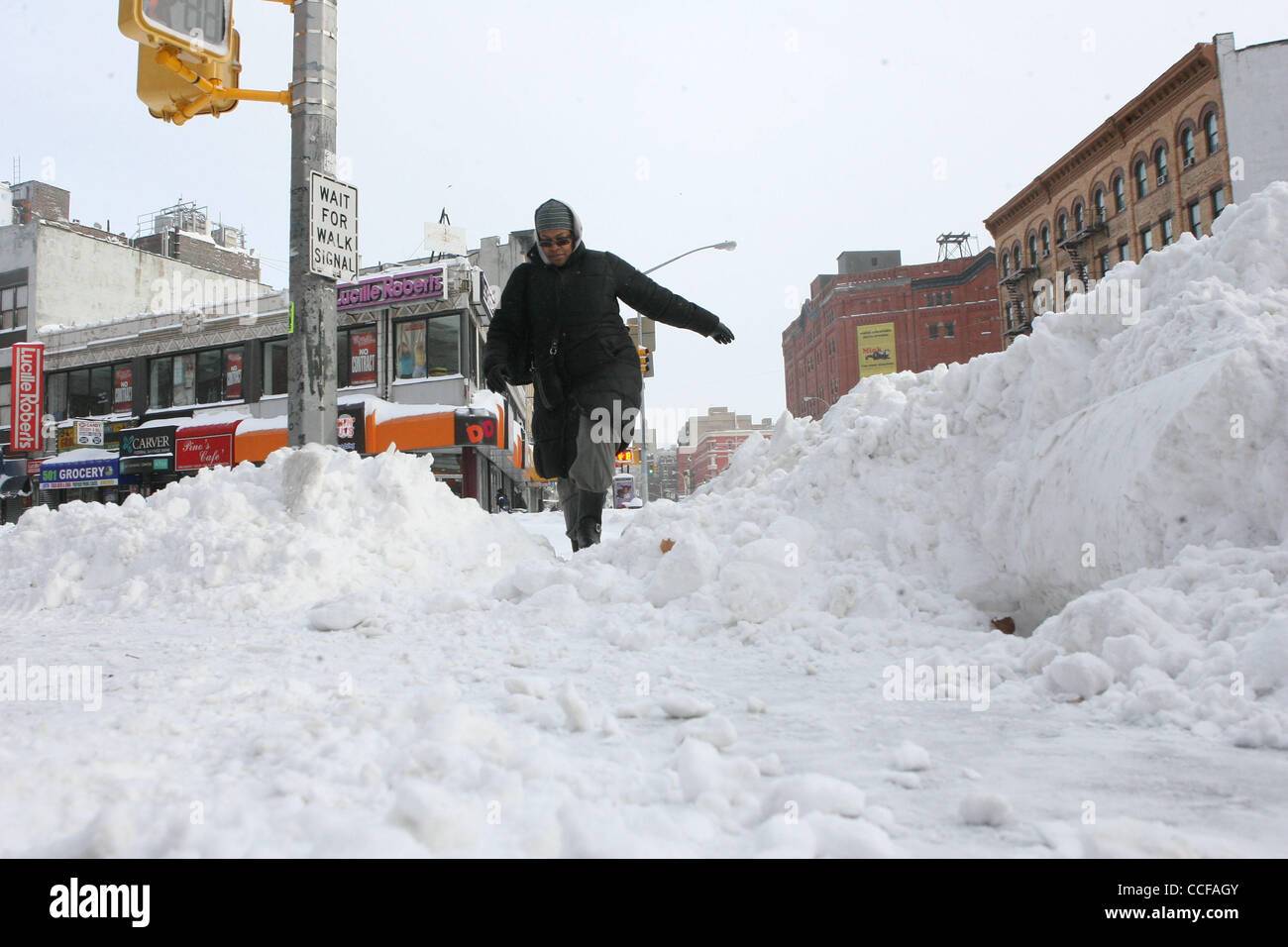Cars trying to get around in the snow, MTA Buses stock in the middle of ...