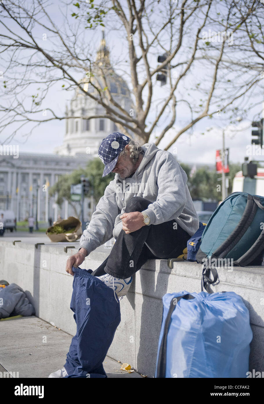 Dec. 27, 2010 - San Francisco, CA, U.S. - A homeless man tries on a ...