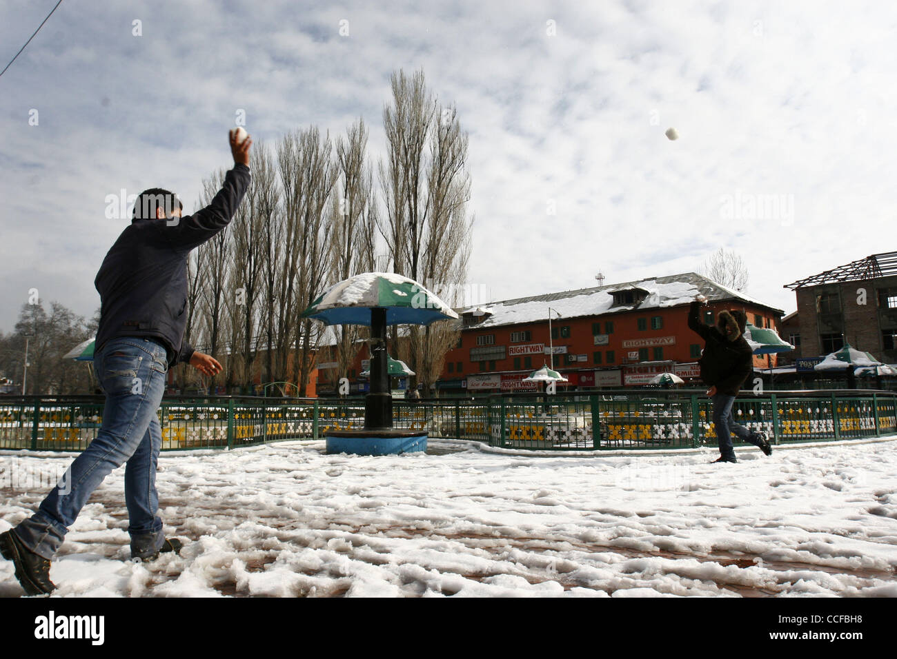 An kashmiri muslim boys playing with snow during suny day after the ...