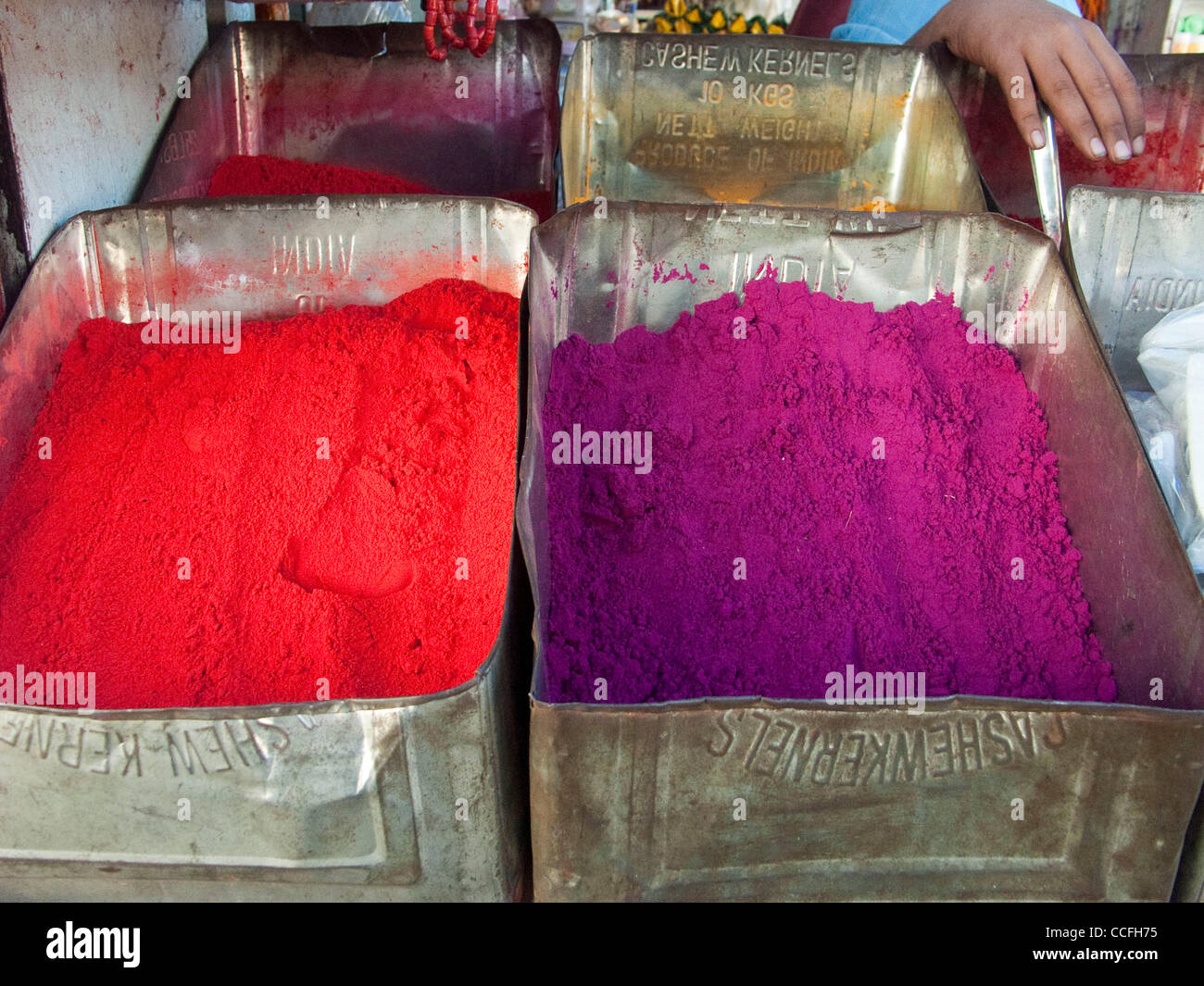 Colored powder used in religious rituals is sold in a market in ...