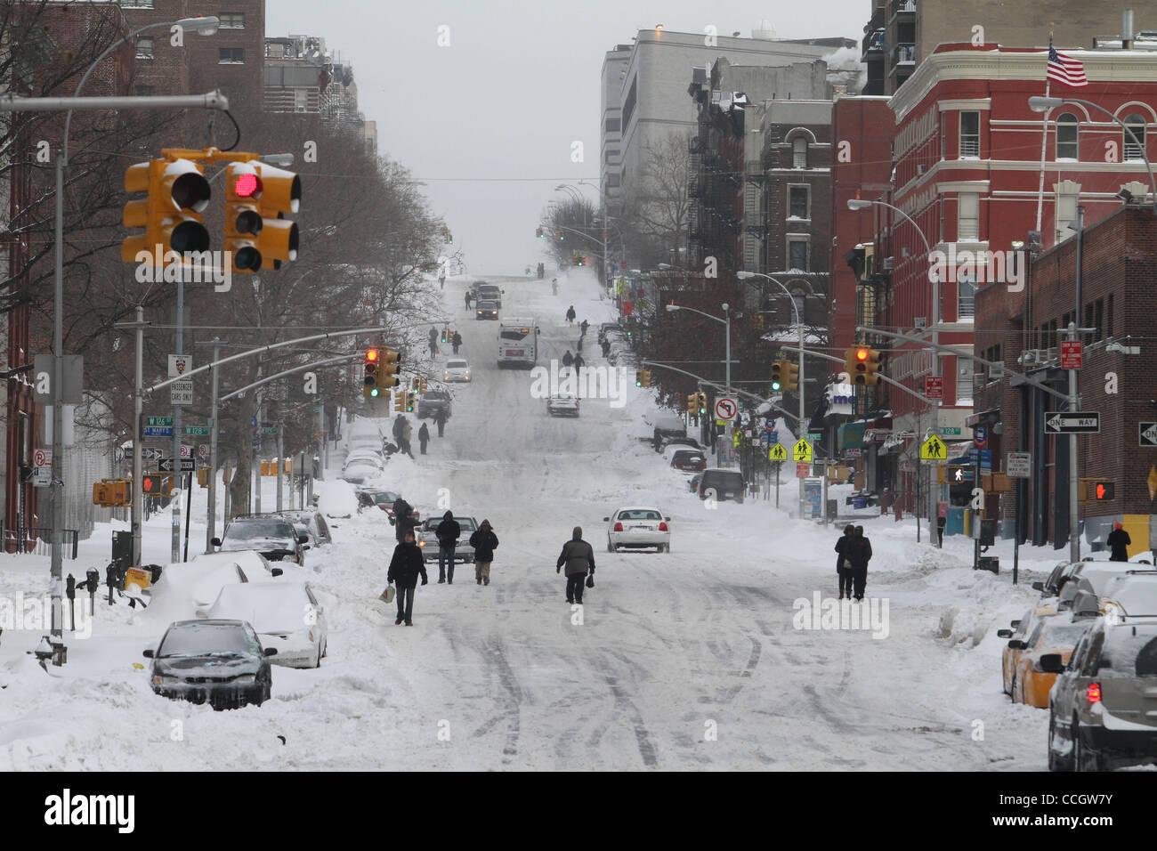 Cars trying to get around in the snow, MTA Buses stock in the middle of ...