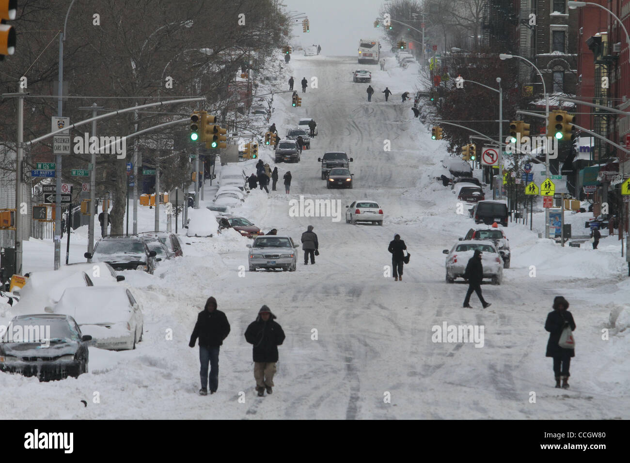 Cars trying to get around in the snow, MTA Buses stock in the middle of ...