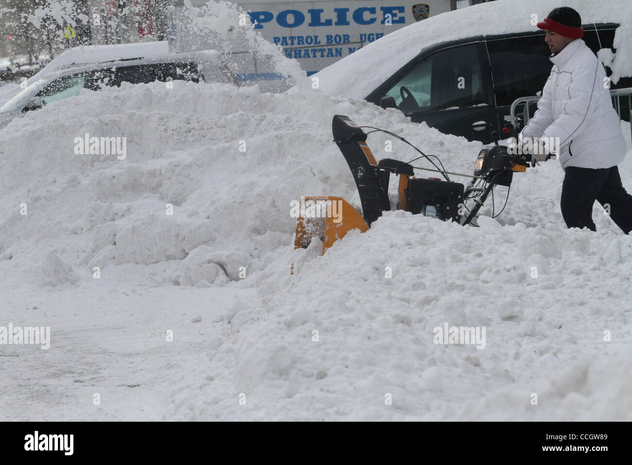 Cars trying to get around in the snow, MTA Buses stock in the middle of ...