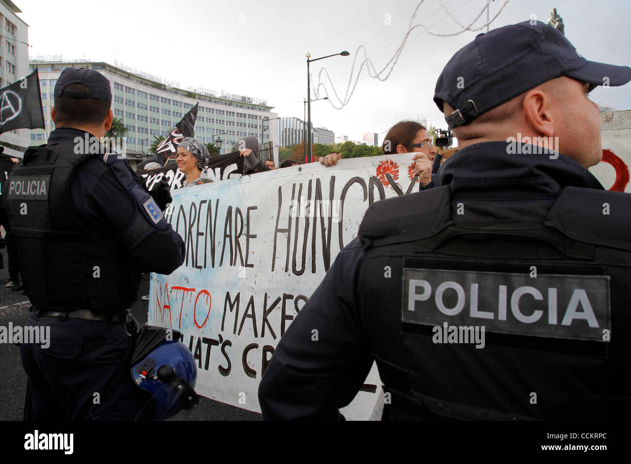 Nov 20, 2010 - Lisbon, Portugal - Riot police stand in front of Anti ...
