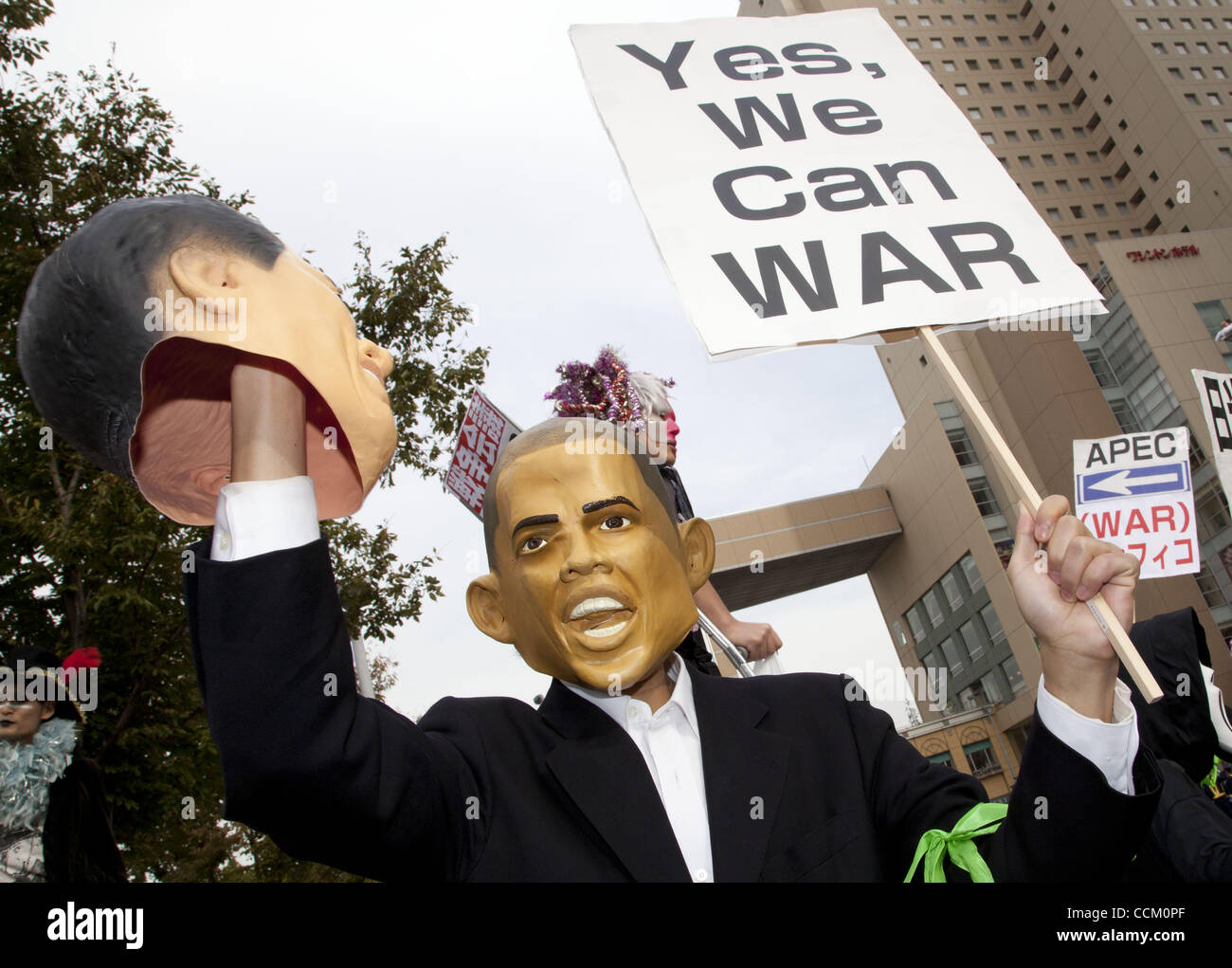 Nov. 13, 2010 - Yokohama, Japan - Activist wearing a mask of U.S ...