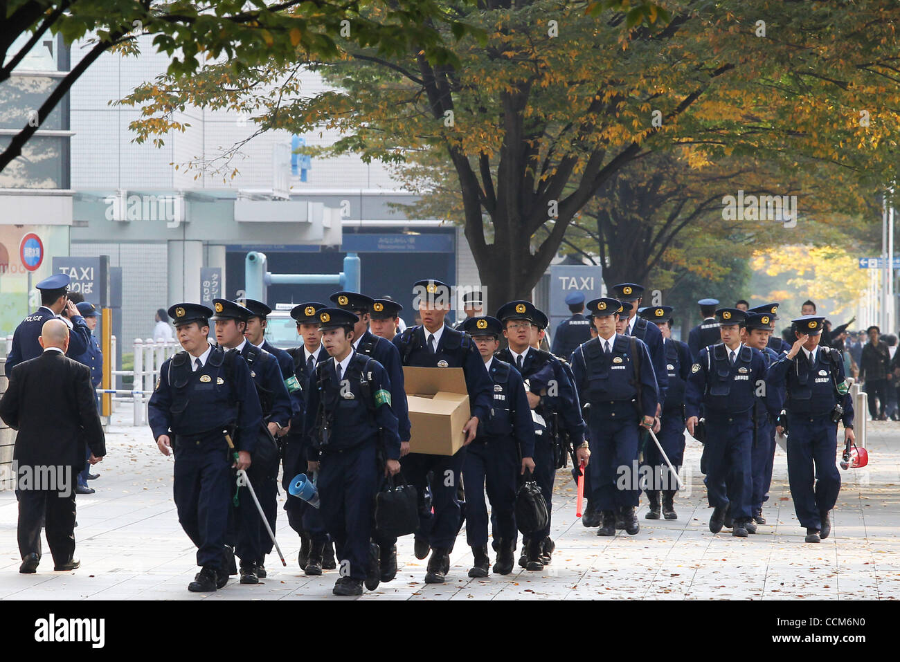 Nov. 8, 2010 - Yokohama, Japan - Policeman walk on the side walk near ...