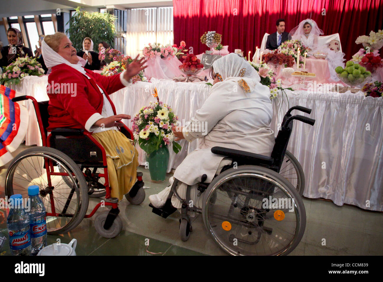Two residents of Kahrizak Charity Foundation dance during a wedding ...