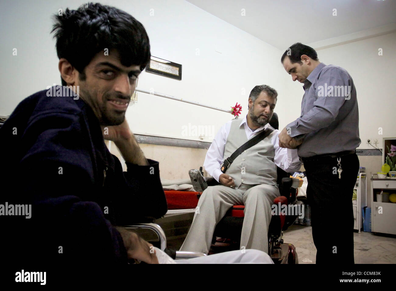 Shahram, A resident of Kahrizak Charity Foundation (center) gets ready ...