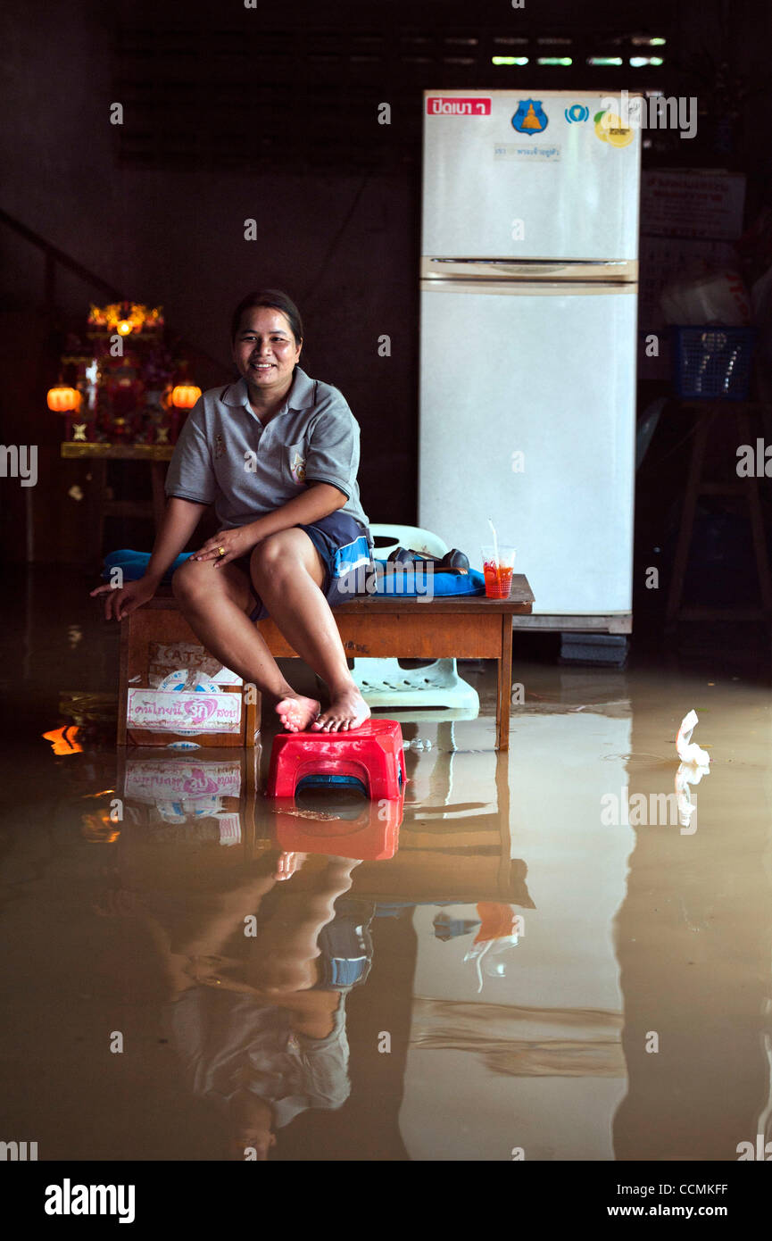 Oct. 27, 2010 - Bangkok, Bangkok, Thailand - A woman sits amid ...