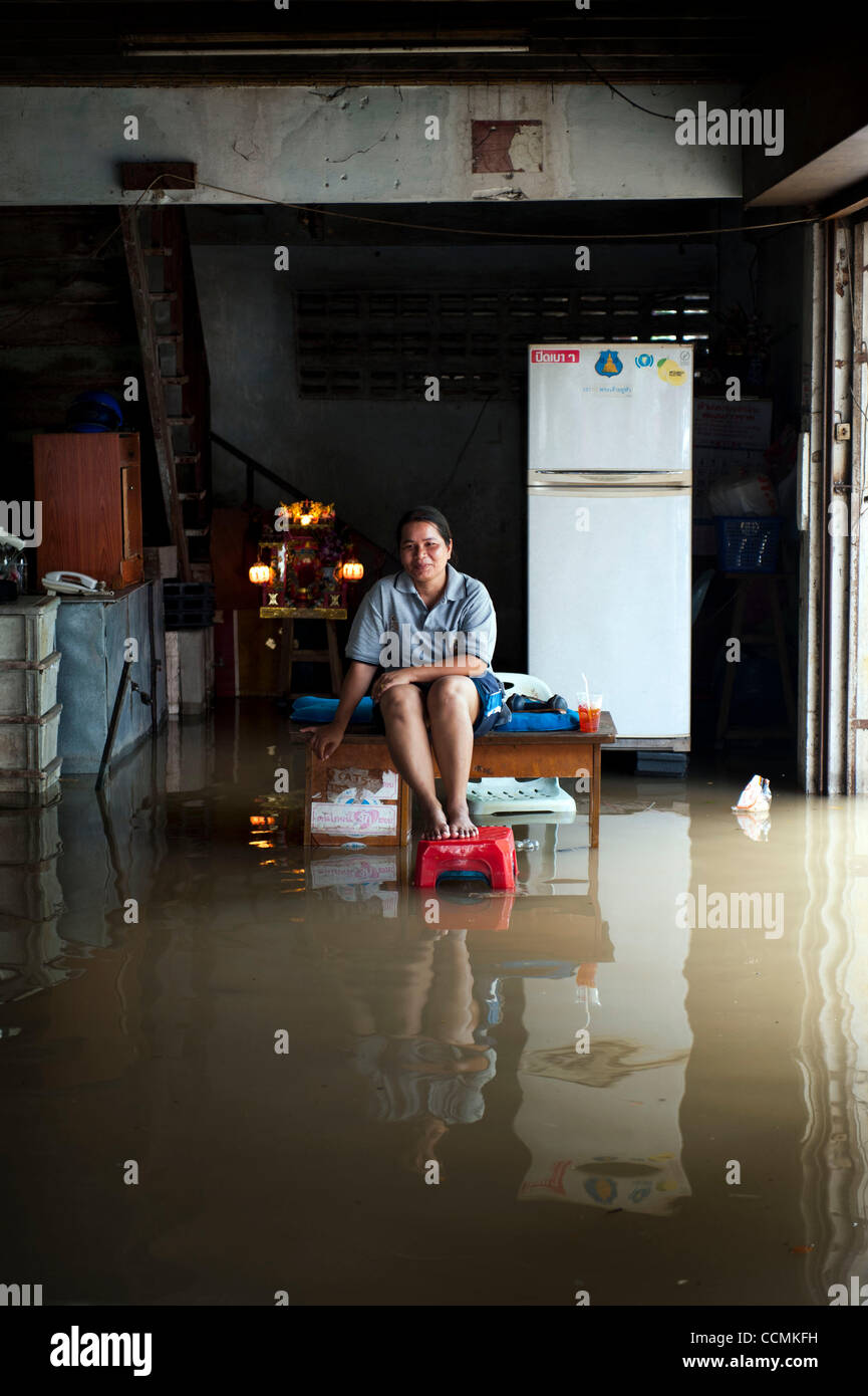 Oct. 27, 2010 - Bangkok, Bangkok, Thailand - A woman sits amid ...