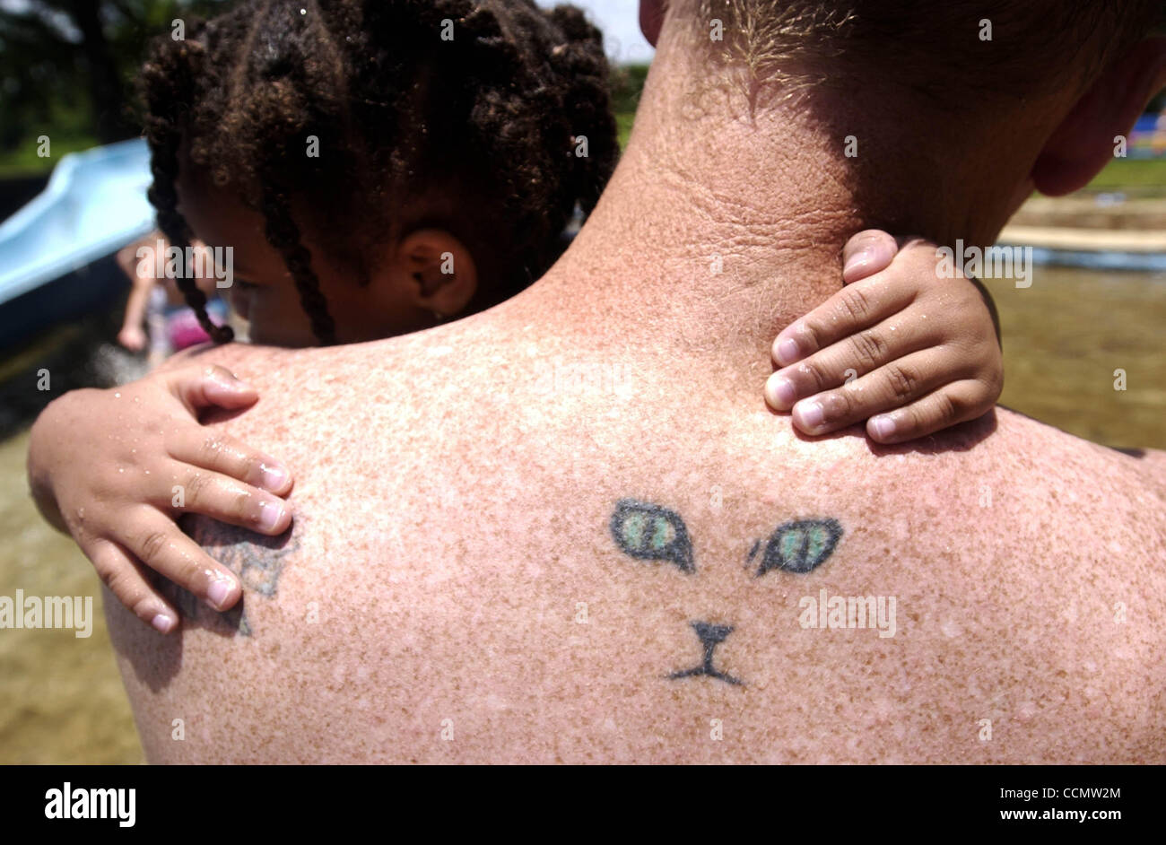 SA LIFE: Mark Sutherland-Trevino holds his adopted daughter Faith at ...